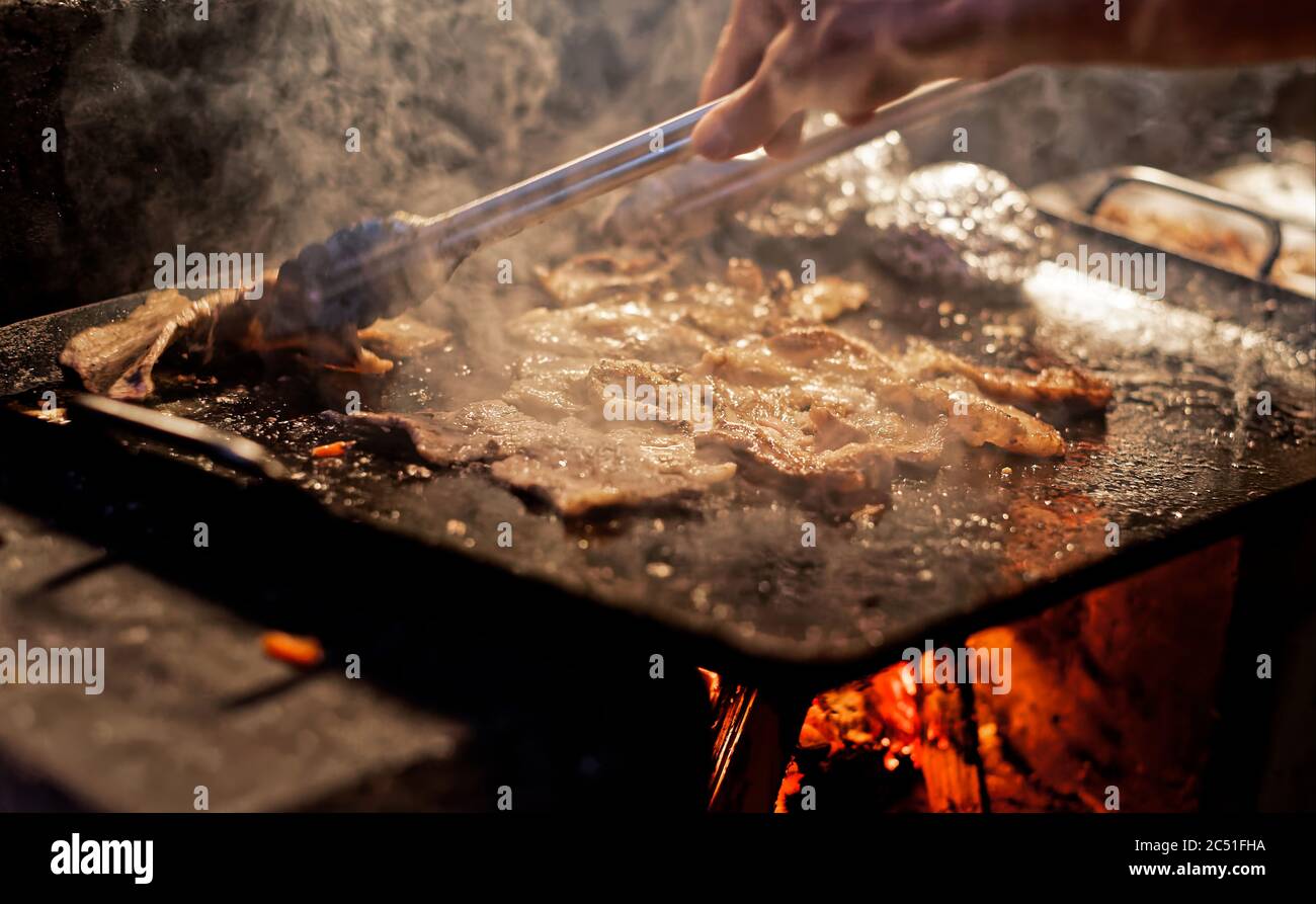 Meat being grilled over wood hi-res stock photography and images - Alamy