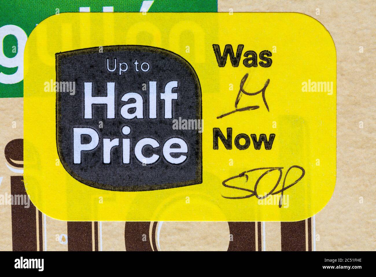 Up to half price yellow sticker label on food product - on box of ...