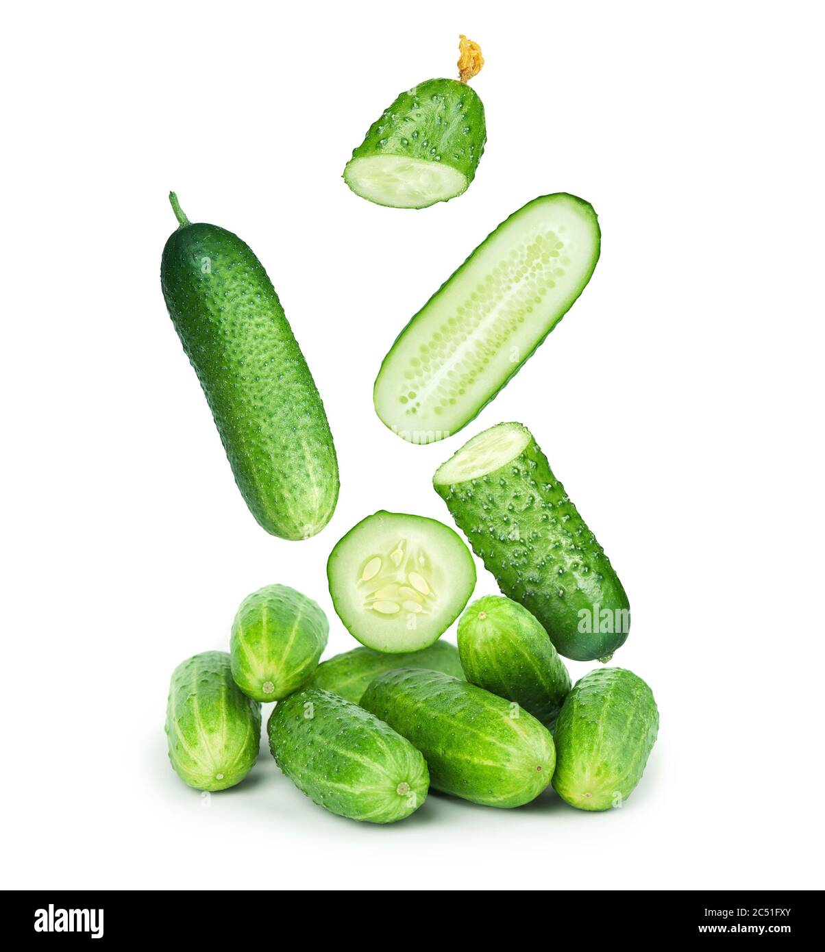 flying fresh cucumbers isolated on white background Stock Photo - Alamy