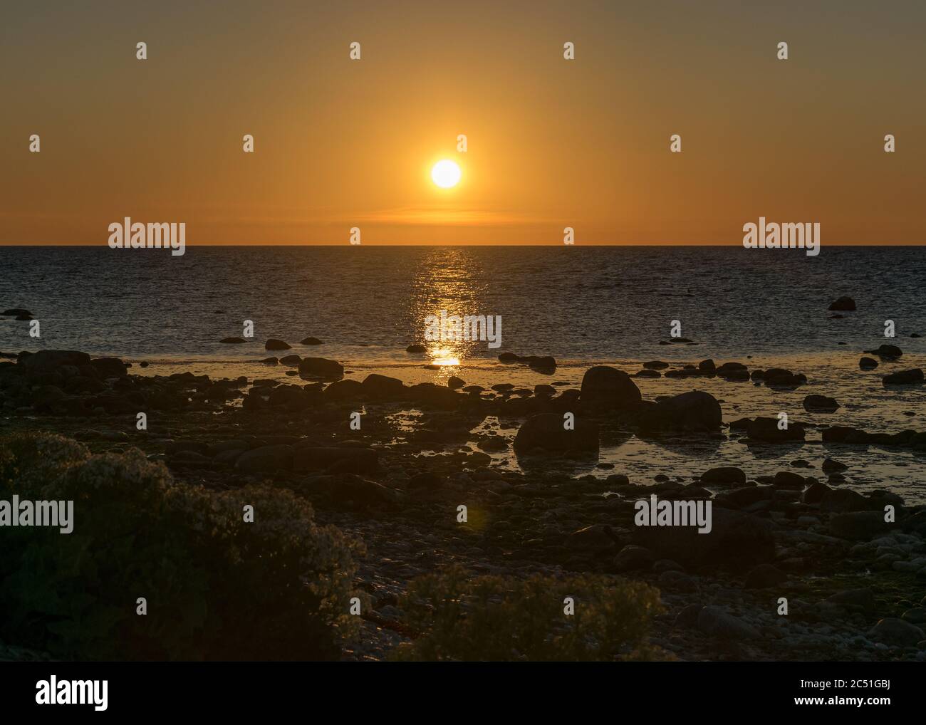 beautiful sunset landscape from a traditional rocky beach on the island ...