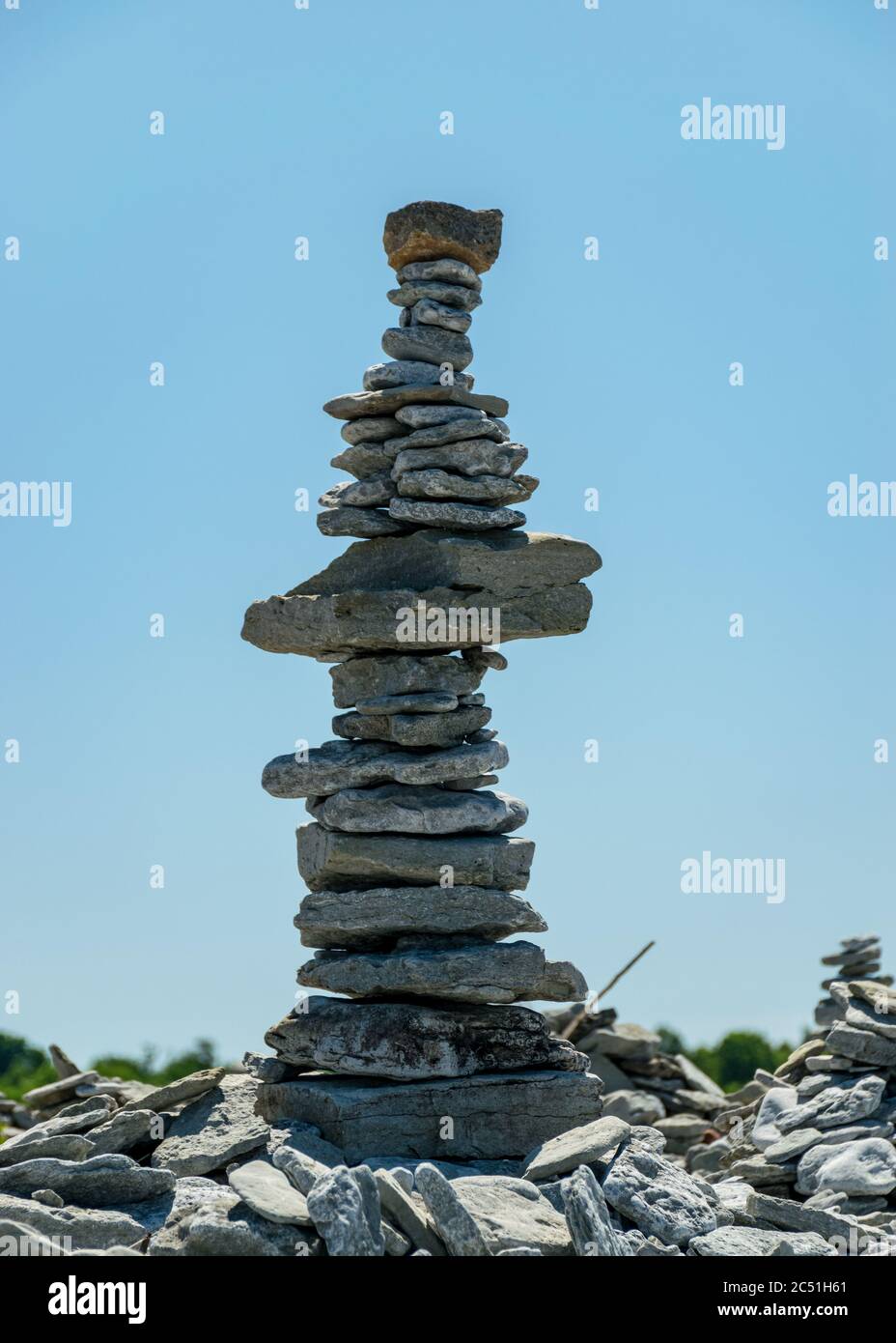 picture with beautiful white stone piles by the sea, these objects were ...