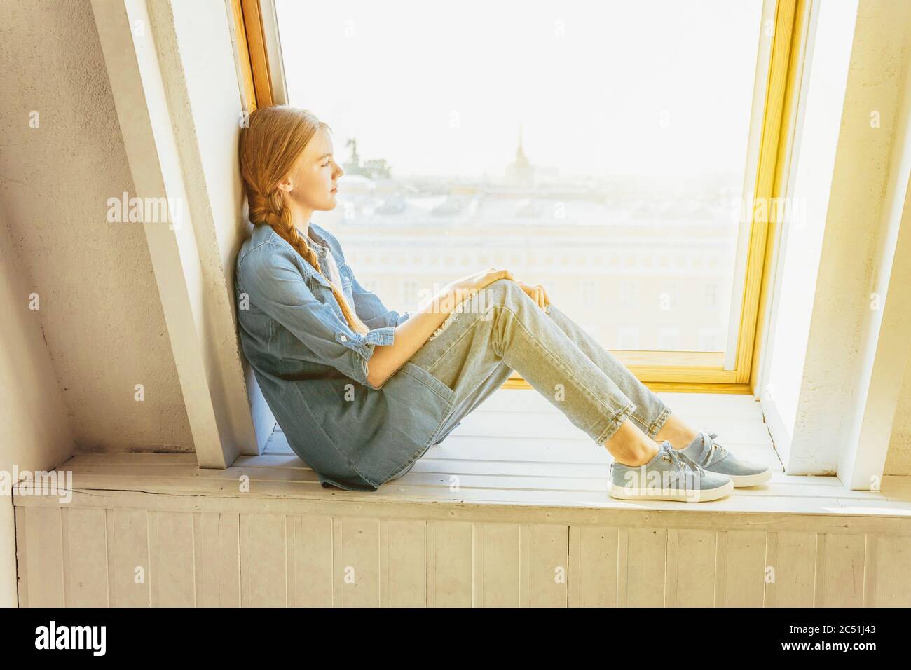 Young cute teenage girl in jeans, denim jacket and white T-shirt ...