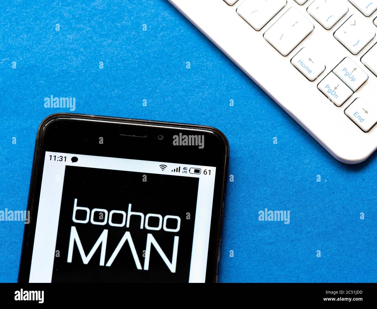 In this photo illustration Boohoo Man logo seen displayed on a ...