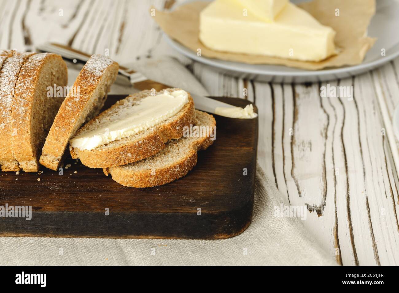 Fresh baked loaf of bread with butter bar Stock Photo - Alamy