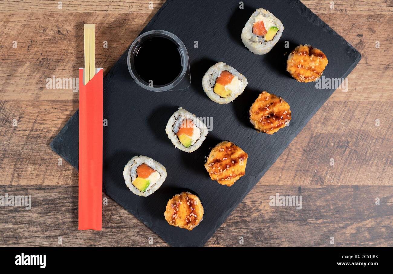 Sushi roll set on the black plate. Japanese food. Top view Stock Photo ...