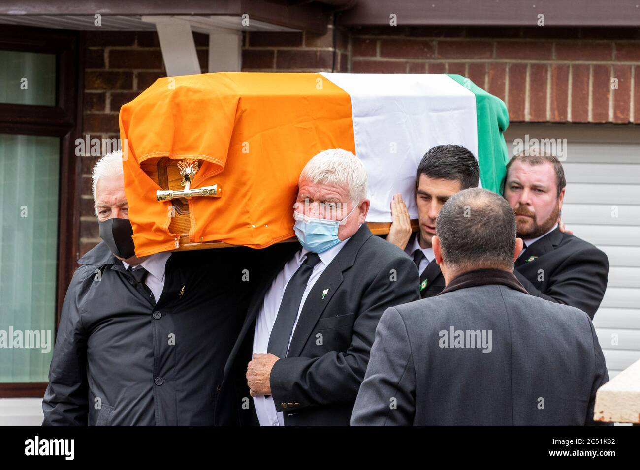 Members of the Storey family carry the coffin of senior Irish ...