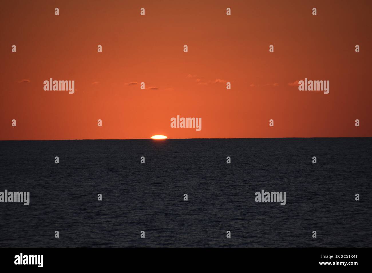 Sunset on the Atlantic Ocean. Unusual color of orange and red during ...