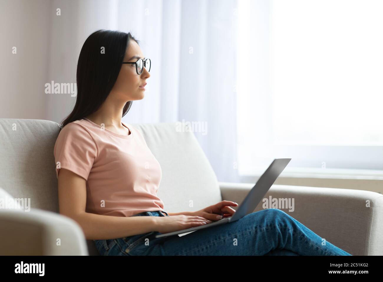 Laptop thoughtful student hi-res stock photography and images - Alamy