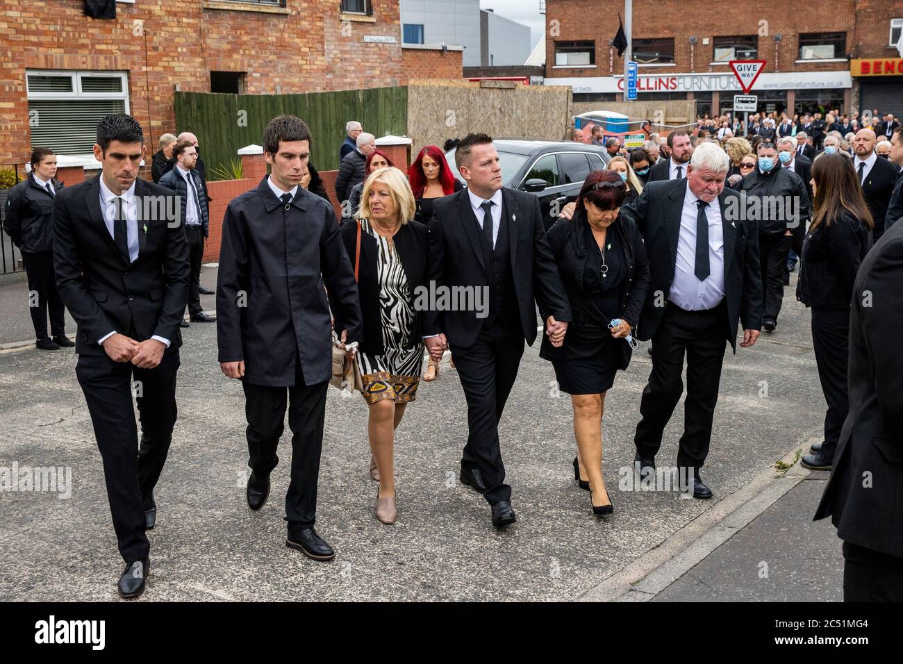 The wife and sons of Bobby Storey arrive at St Agnes' Church in west ...