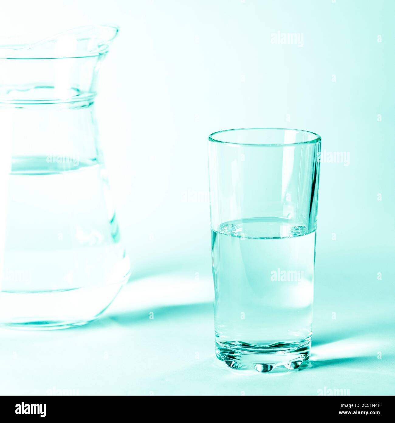 Glass with clean clear water on a white background Stock Photo - Alamy