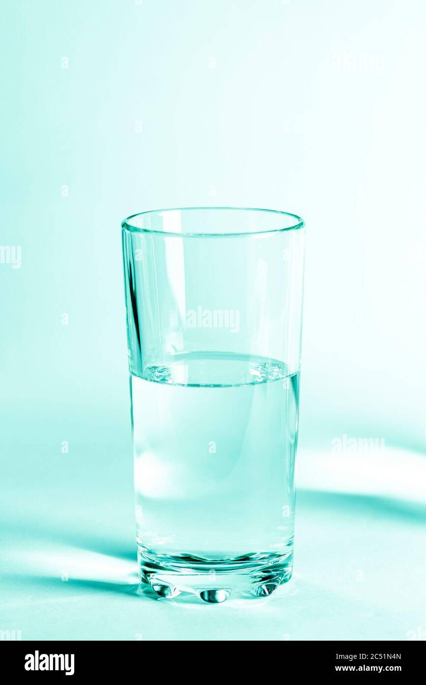 Glass with clean clear water on a white background Stock Photo - Alamy