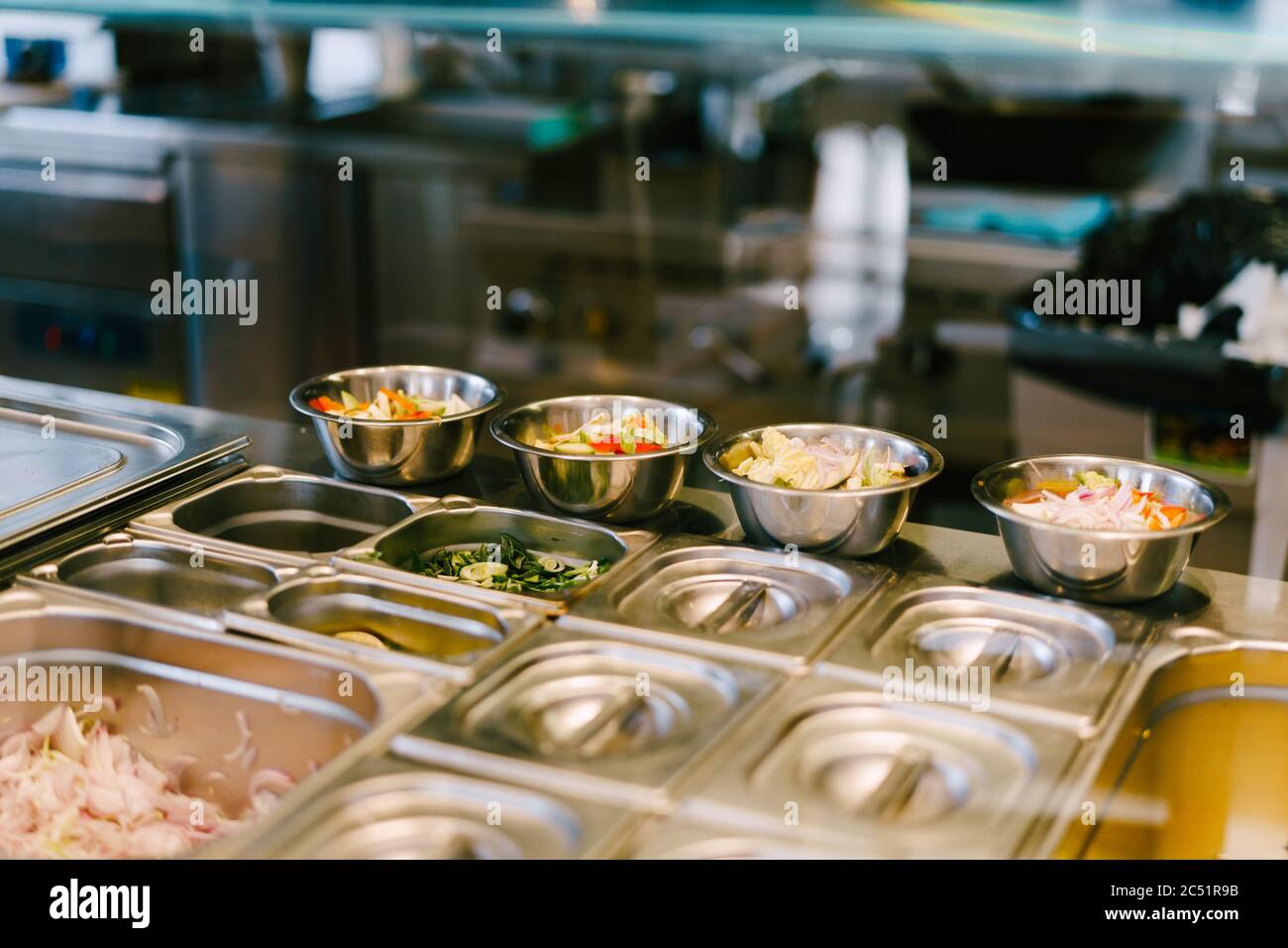 Bowls of ingrediants for Wok-style noodles and rice in an Asian ...