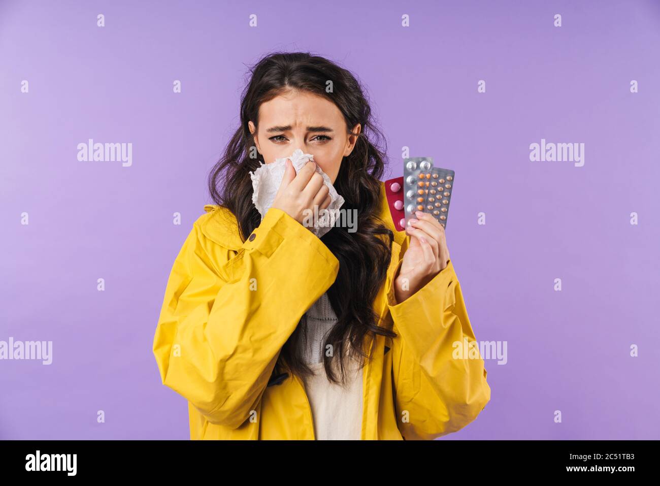 Image of ill sick woman isolated over purple wall background holding ...