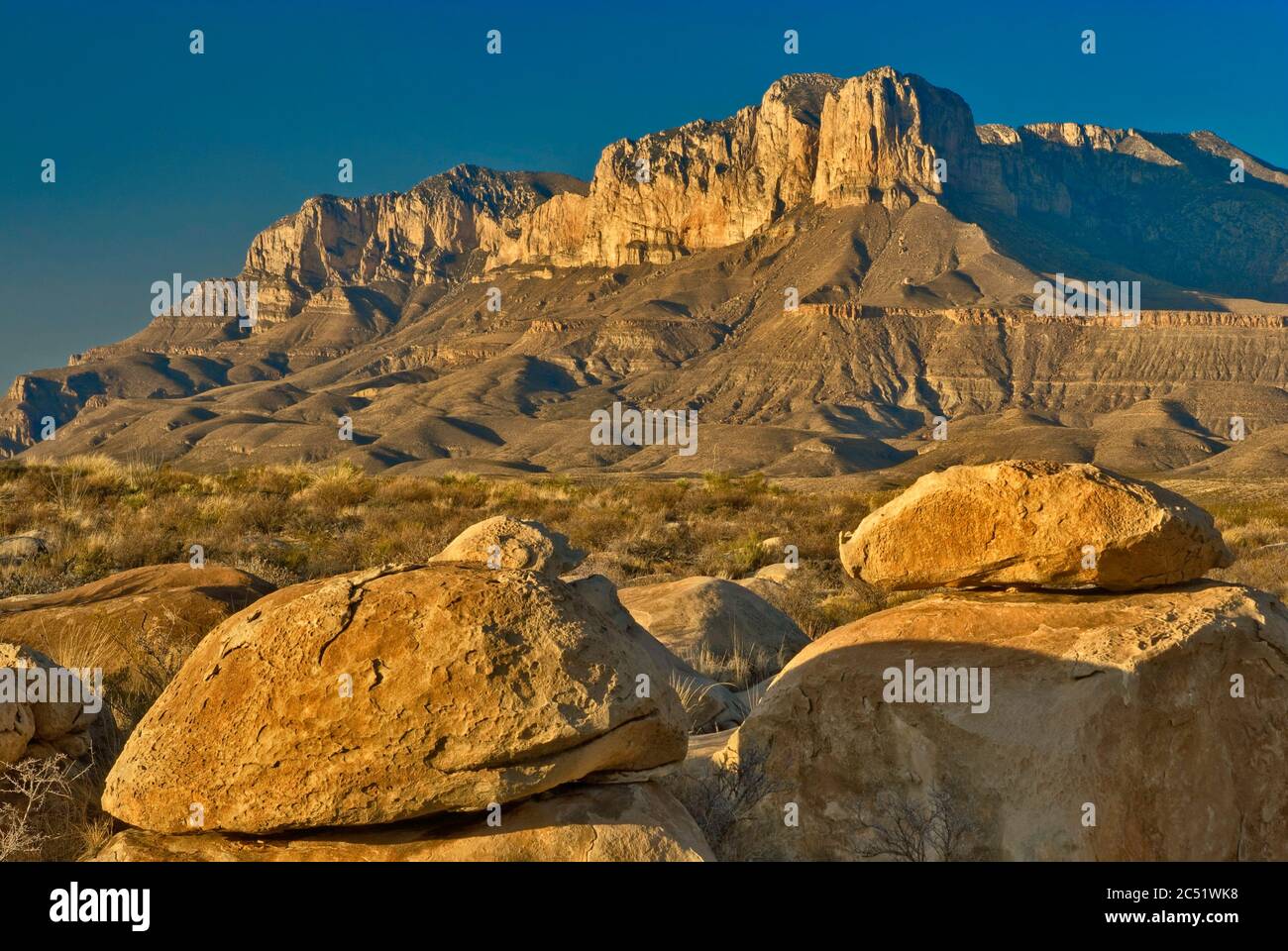 Limestone boulders, western escarpment of Guadalupe Mountains at sunset ...