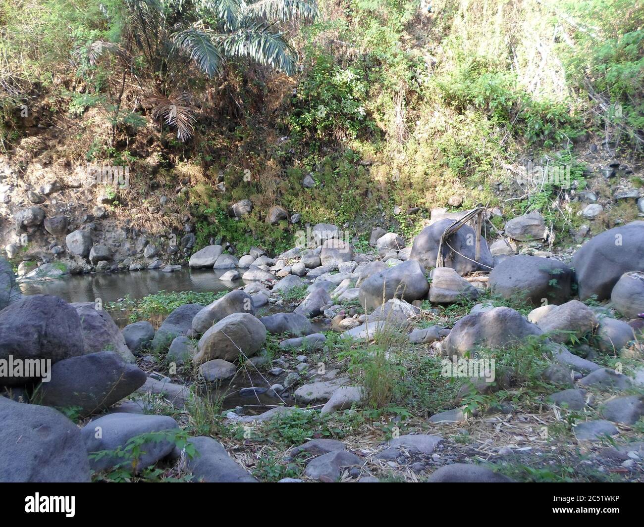 Landscape shot of rocks in various sizes in a lakeside Stock Photo - Alamy
