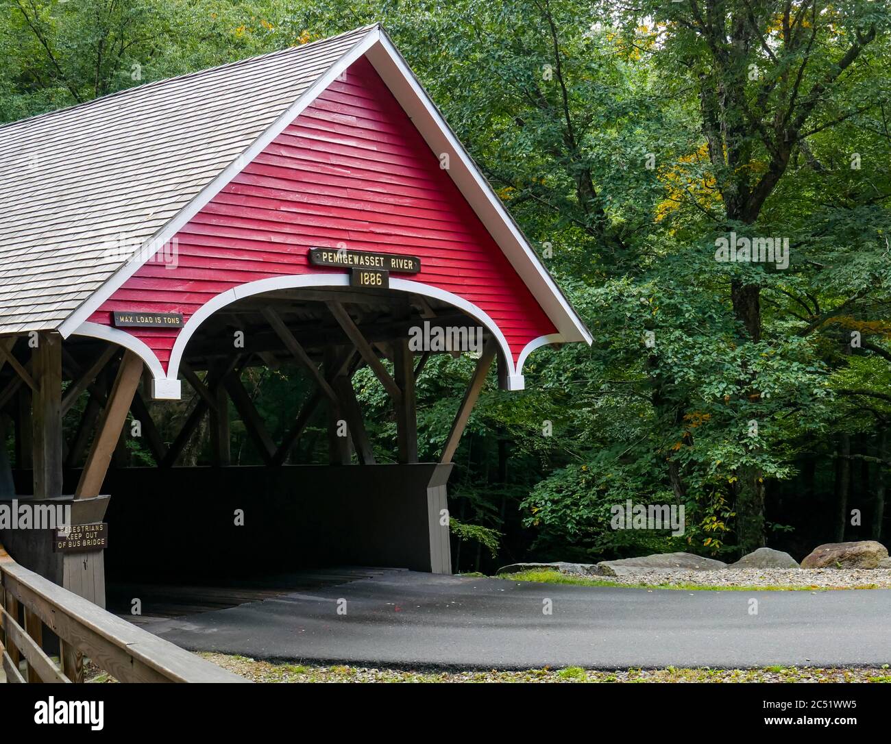 Old historic wooden flume covered bridge over Pemigewasset River ...
