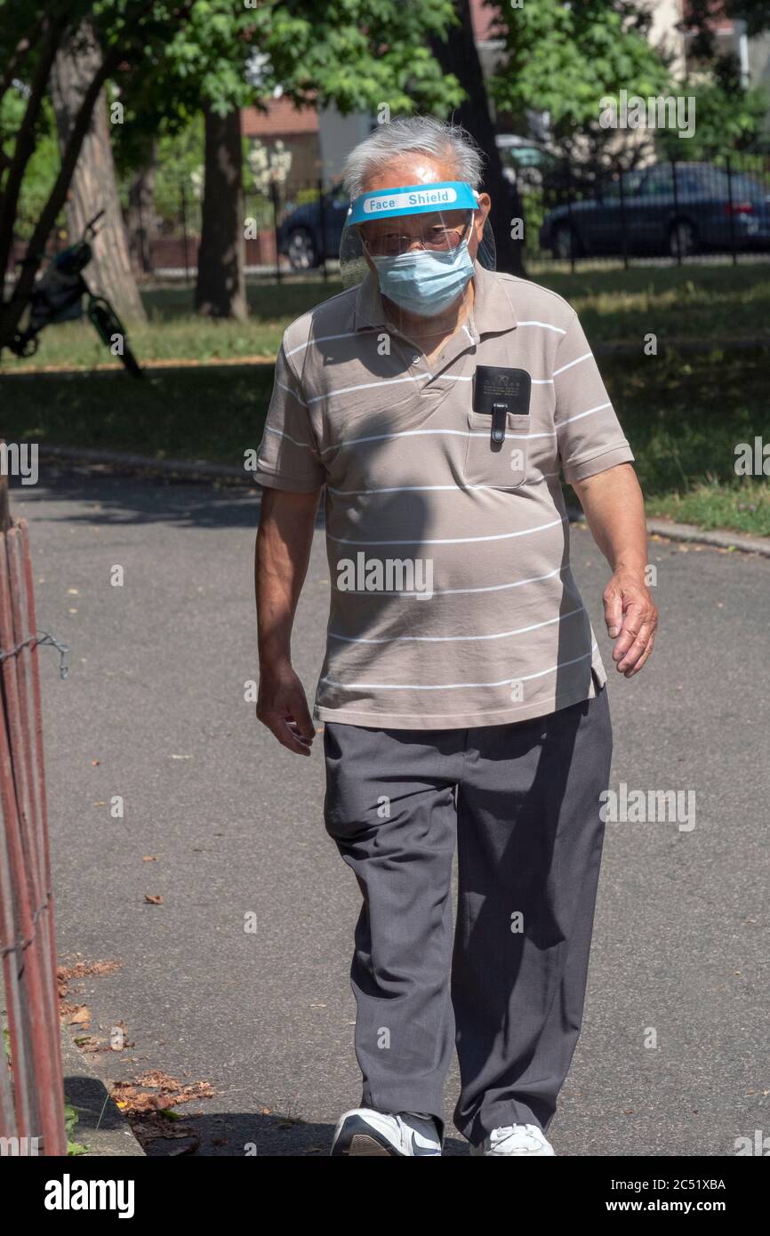 An older Asian American man, likely Chinese American, exercise walks in ...