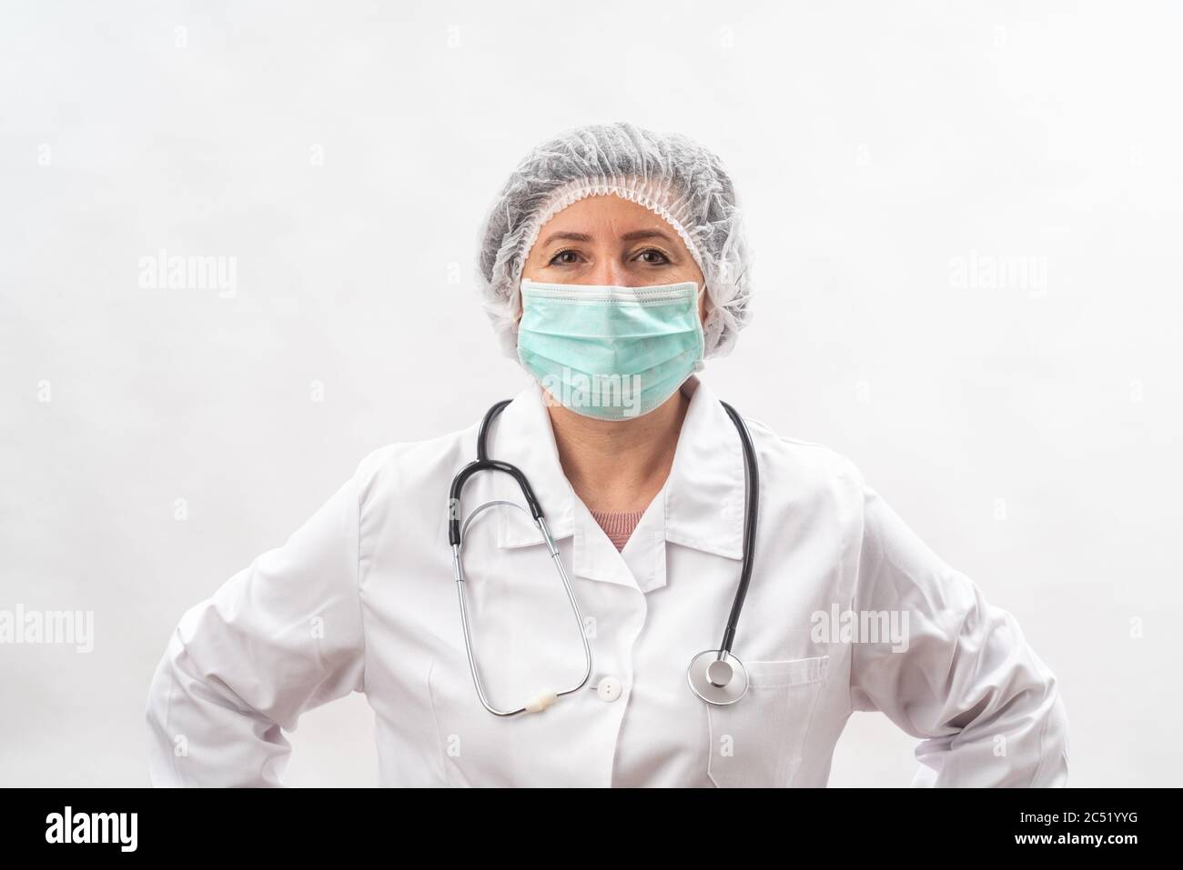 Tired female medic, nurse in protective equipment and a mask from ...