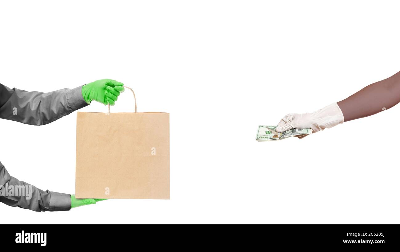 arm delivery man hold in hands brown craft paper package and black skin ...