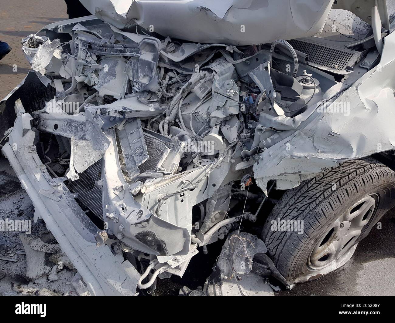 engine compartment damaged by accident and covered with a layer of ...
