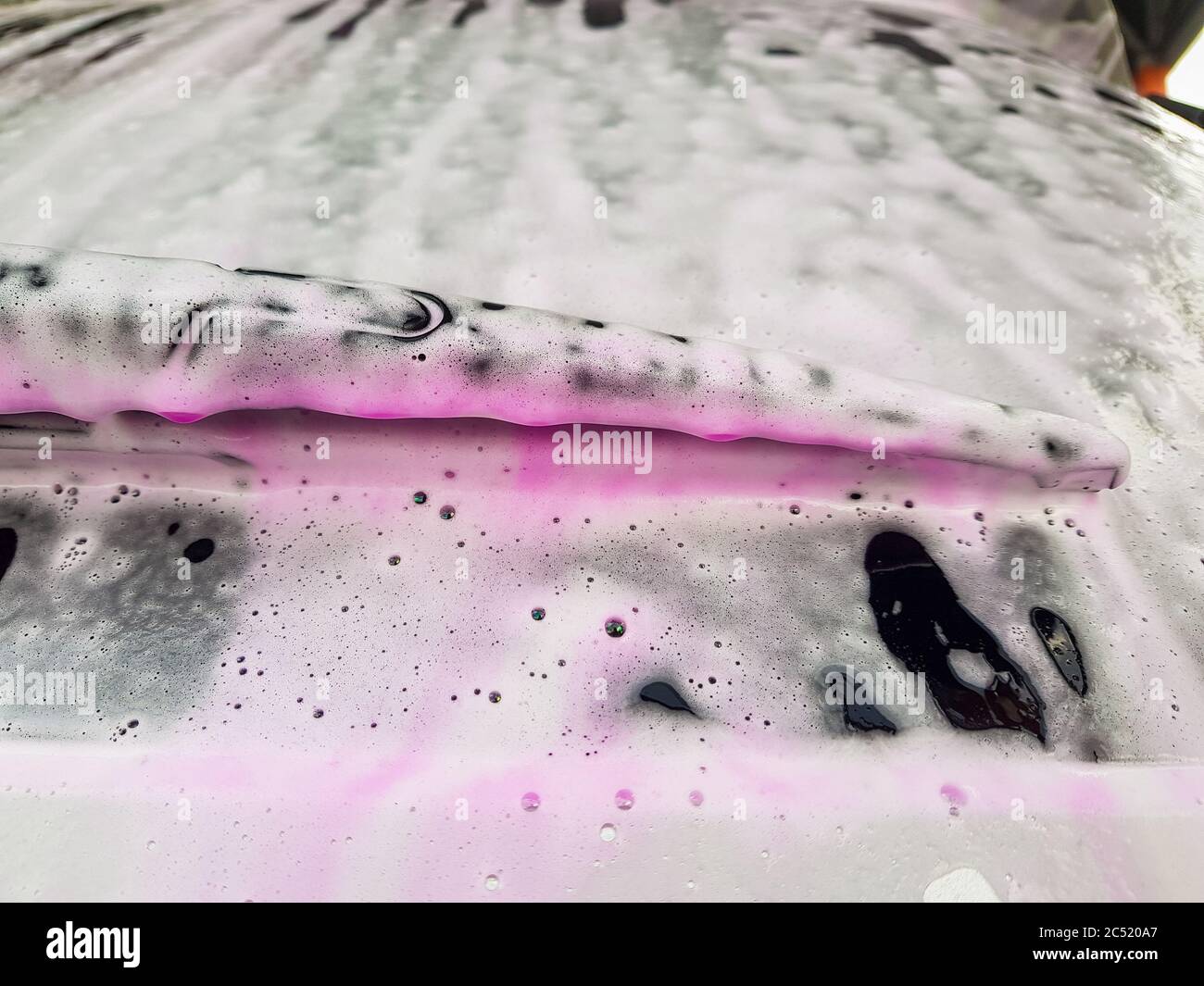 rear window wiper blade coated with detergent active foam with bubbles ...