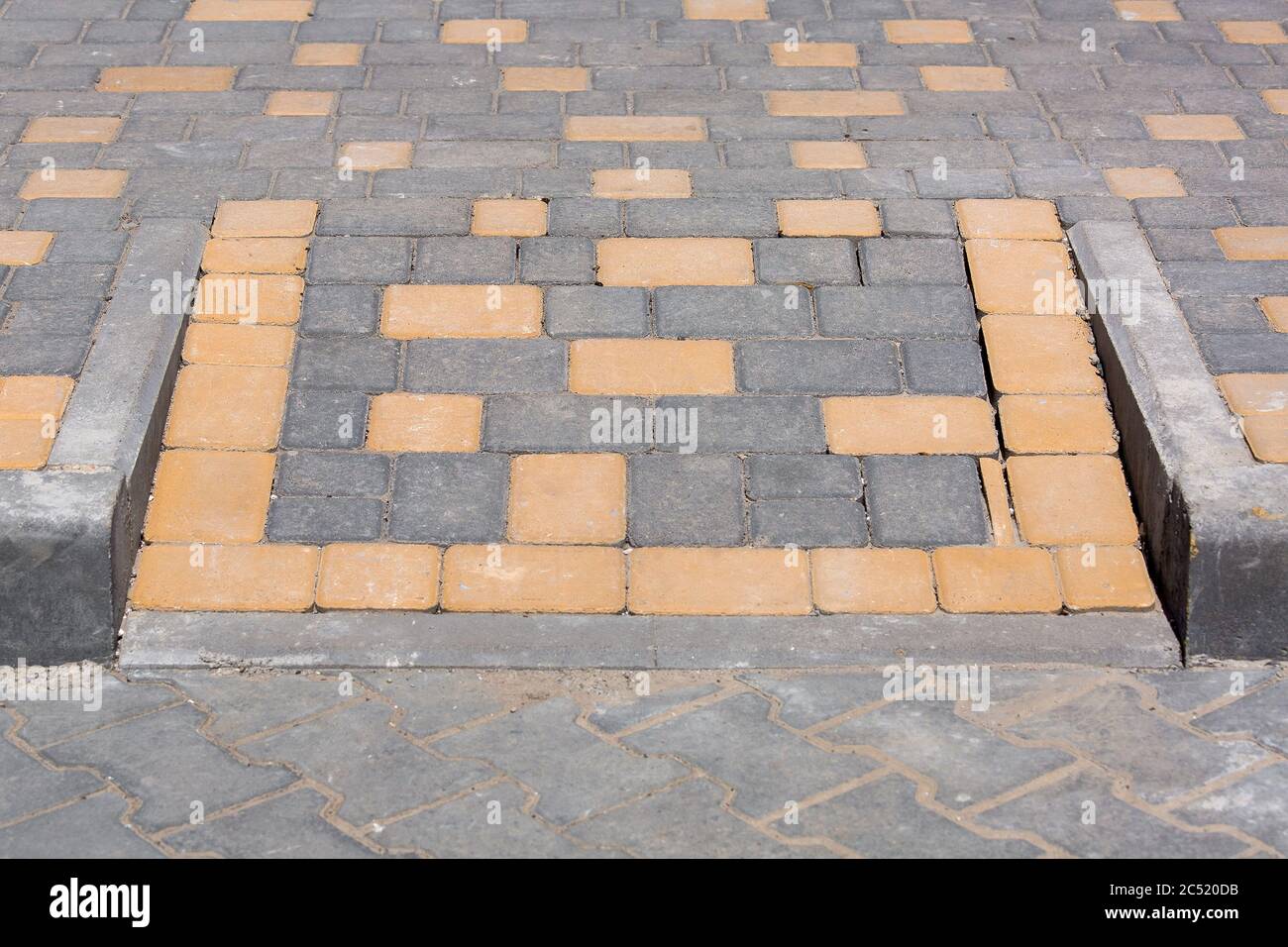A ramp for lowering disabled people from a pedestrian sidewalk onto a ...
