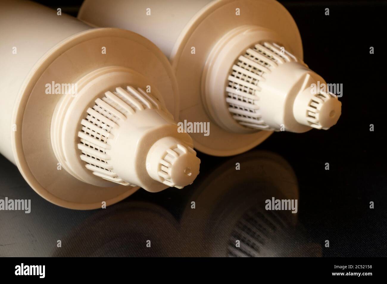 The White plastic filter on table. Instrument for peelings of water on ...