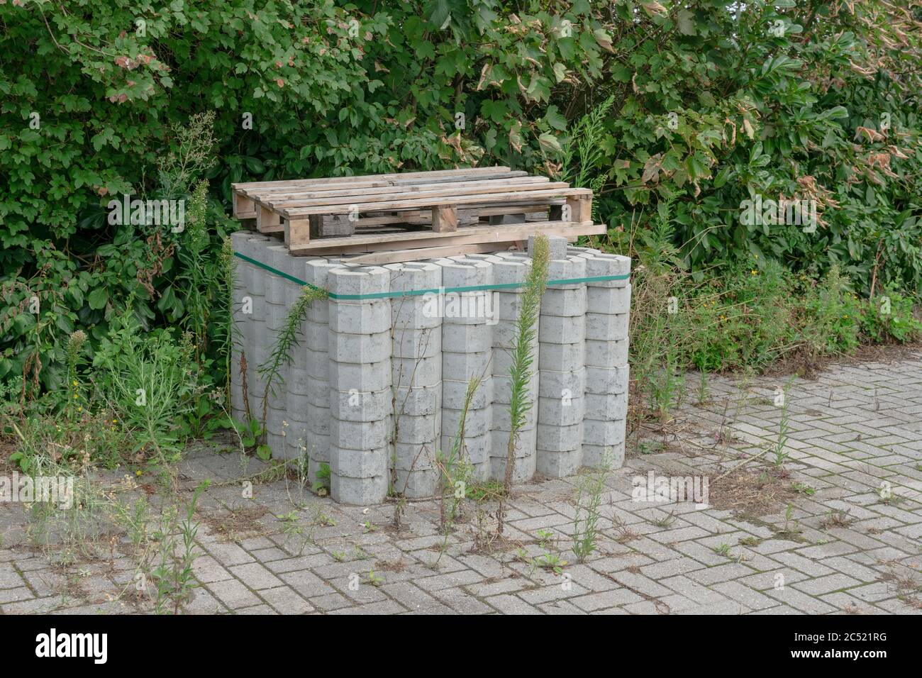 stack of hexagonal concrete bricks with wooden pallets on them Stock ...