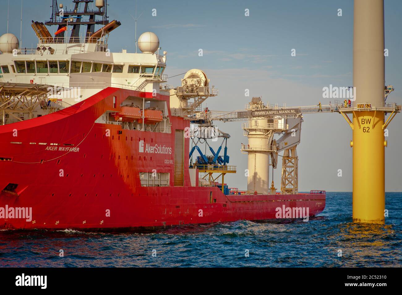 Offshore support vessel holding station using dynamic positioning, with ...