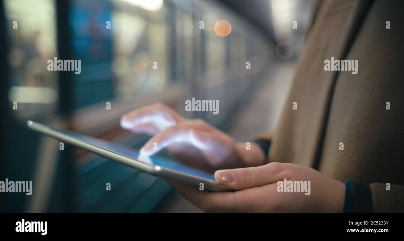 Train station with people using tablet hi-res stock photography and ...