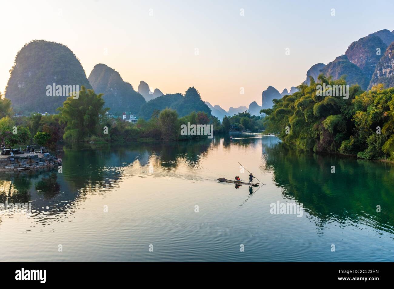 YANGSHUO, CHINA, 6 DECEMBER 2019: Beautiful sunset on the Yulong River ...