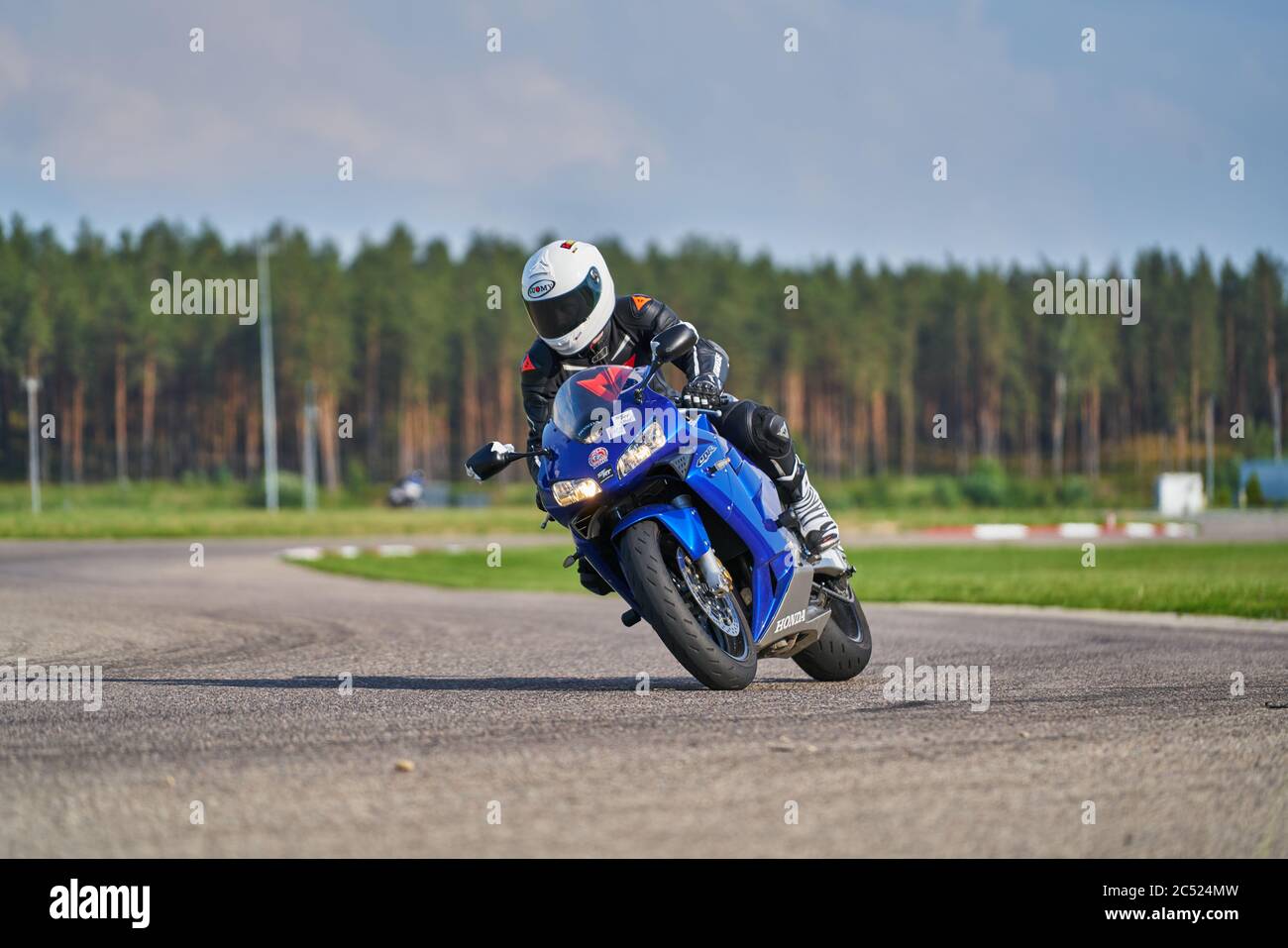 11-05-2020 Riga, Latvia. man on a motorbike on the road riding. having ...