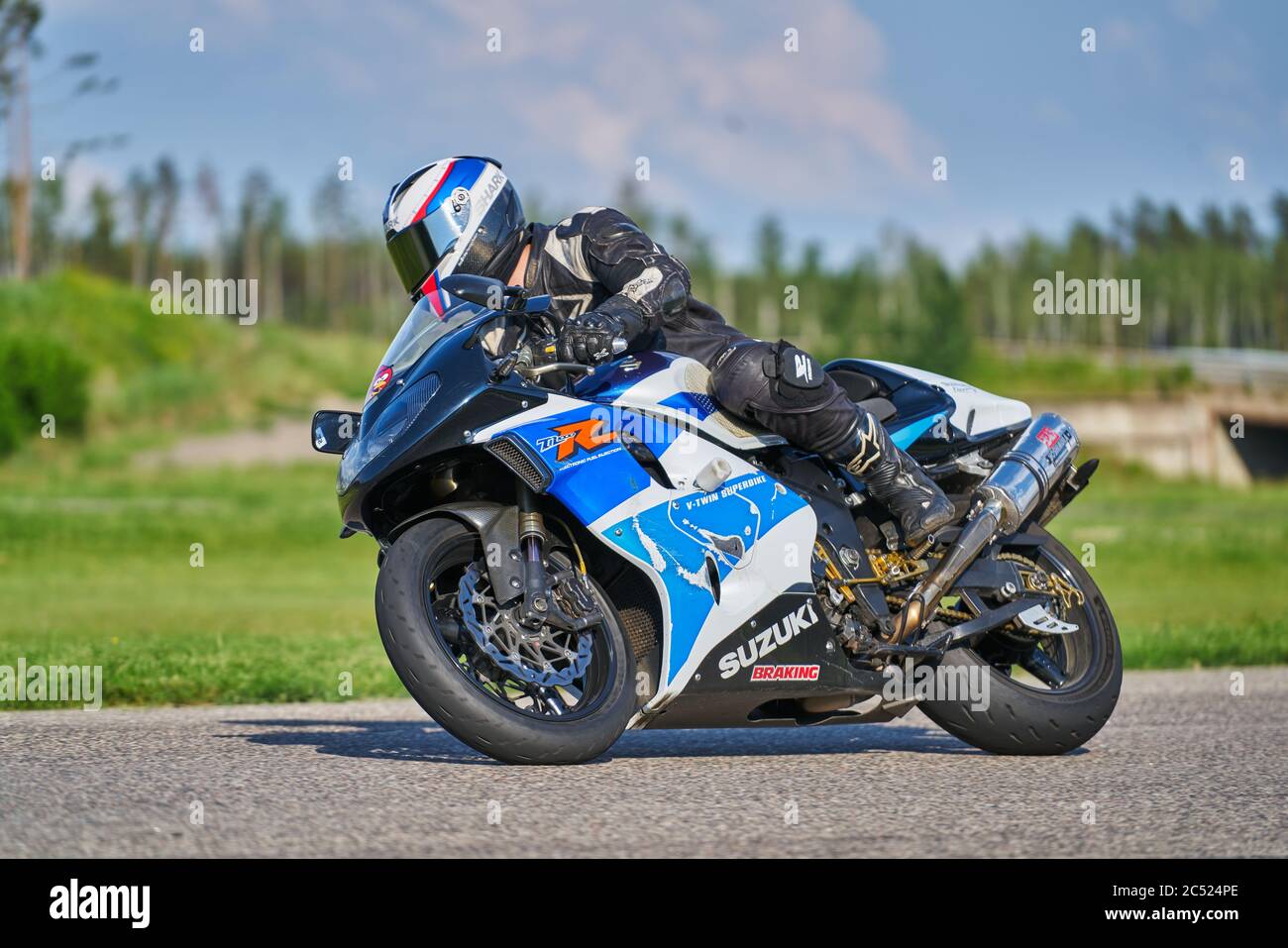 11-05-2020 Riga, Latvia. man on a motorbike on the road riding. having ...