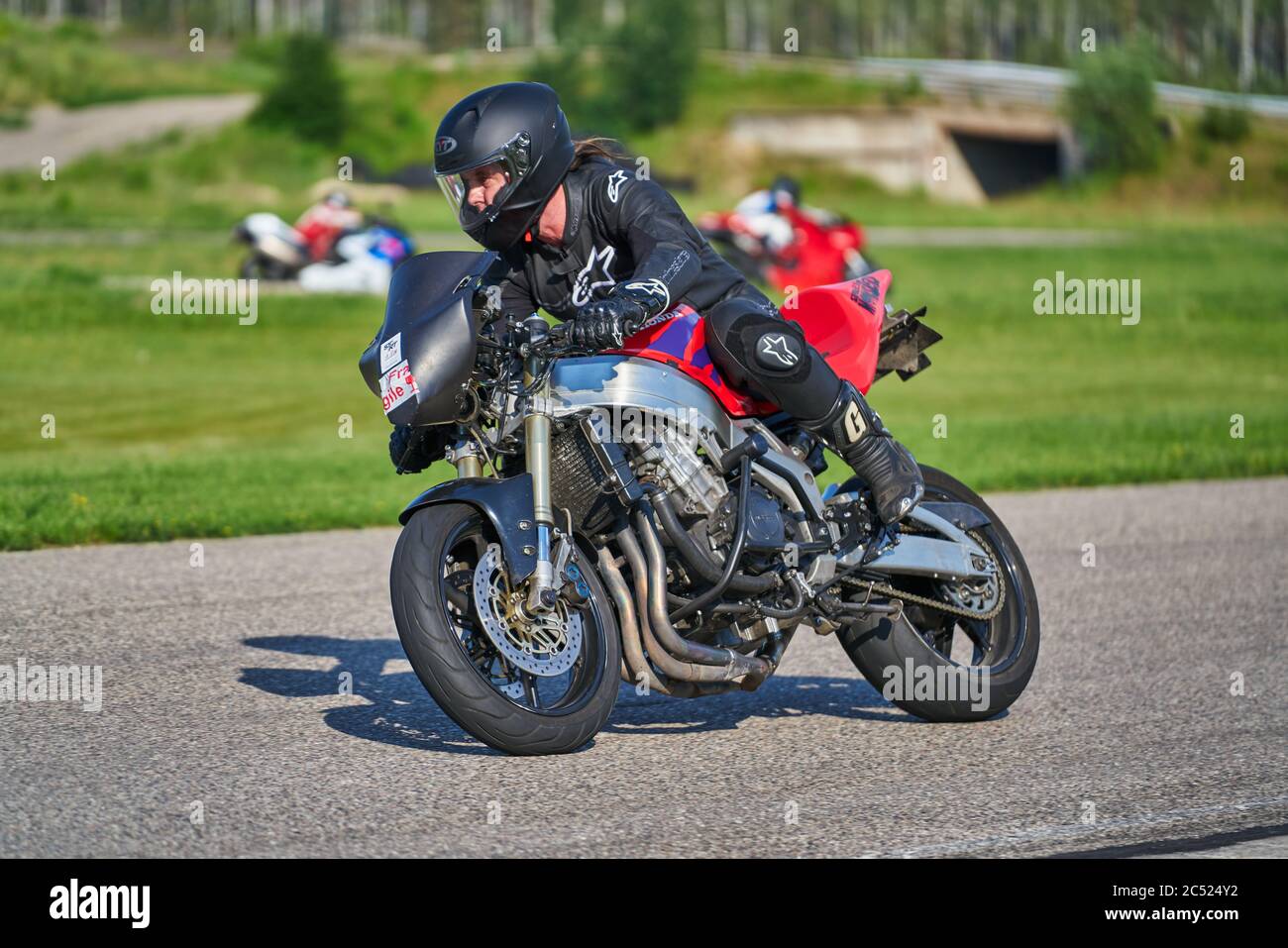 11-05-2020 Riga, Latvia. man on a motorbike on the road riding. having ...
