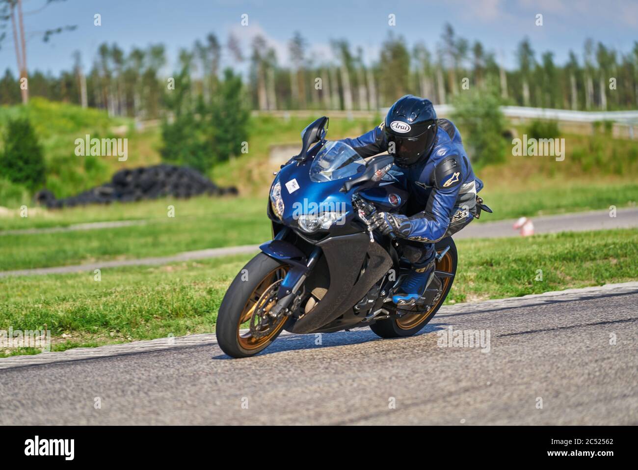 11-05-2020 Riga, Latvia. man on a motorbike on the road riding. having ...