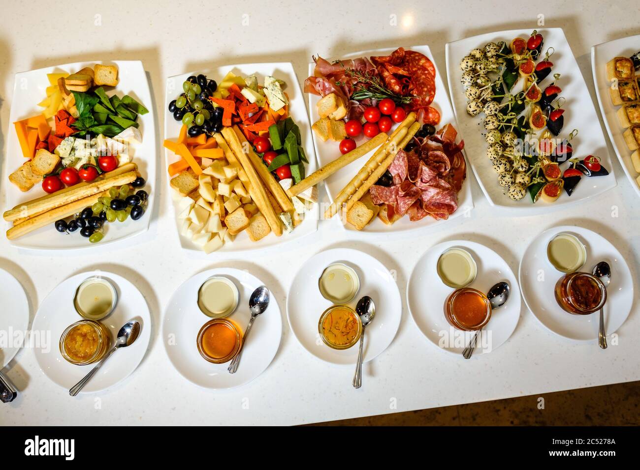 Top view of tasty appetizers with honey on a white table Concept of ...
