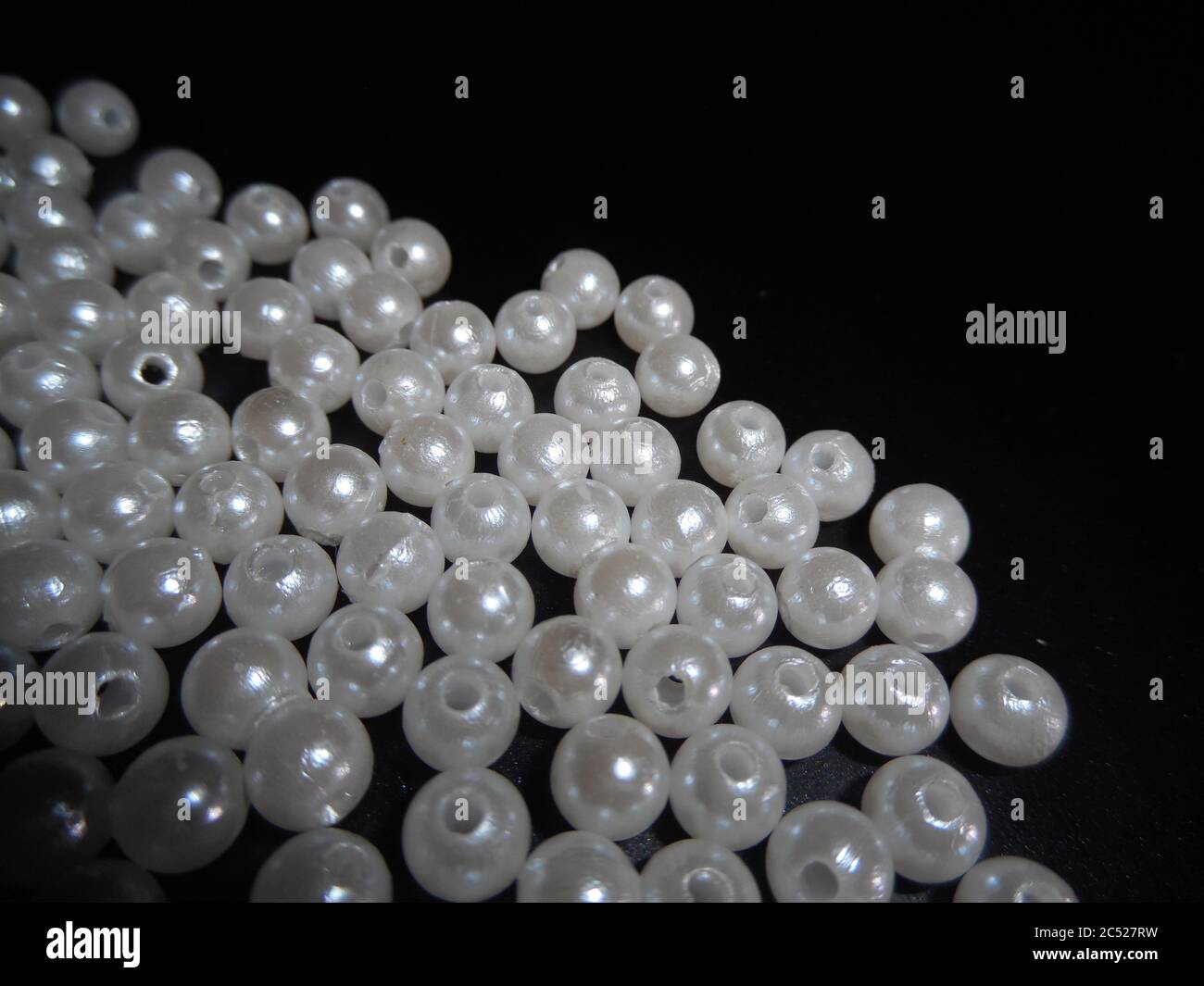 pearls on black background Stock Photo - Alamy