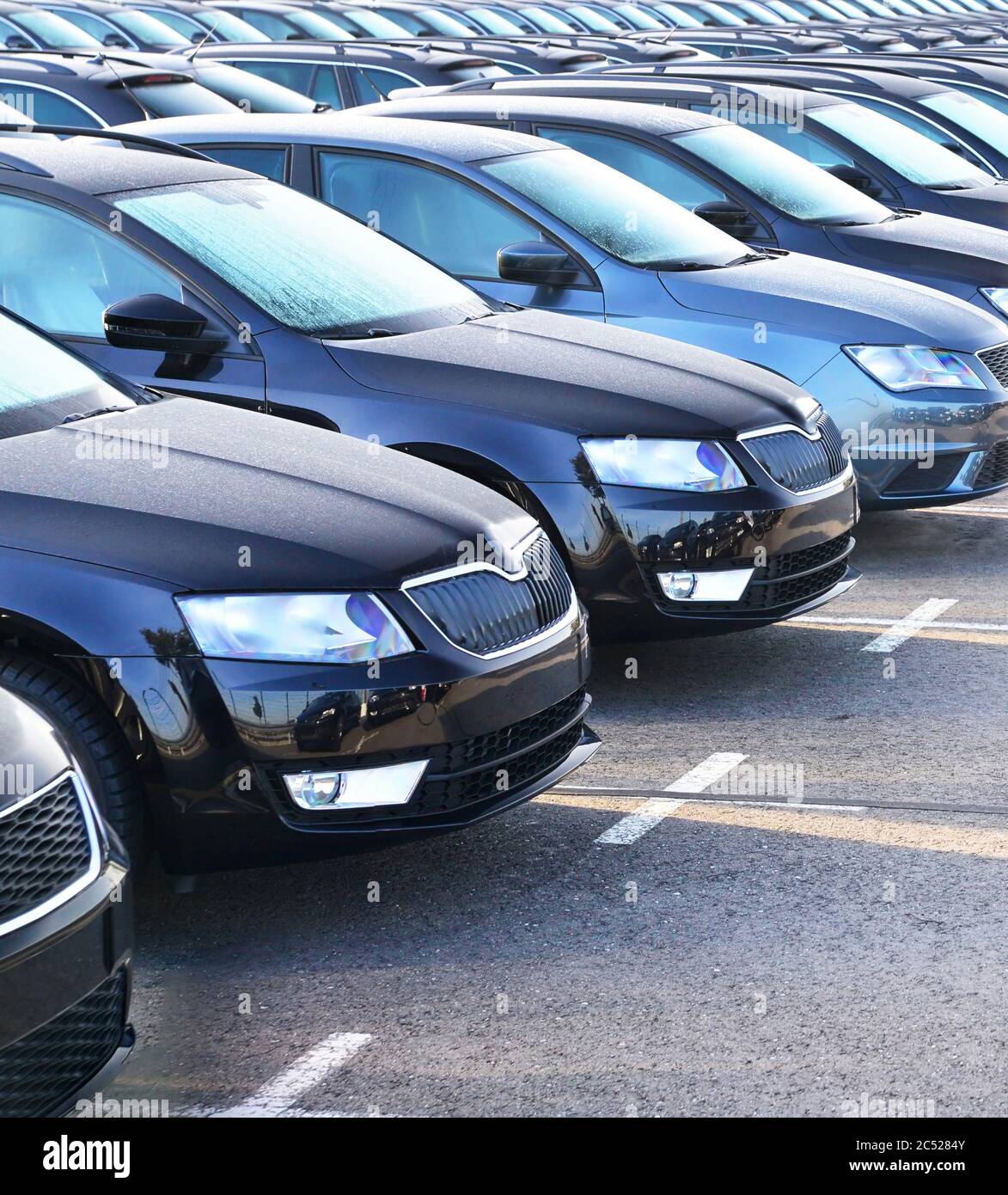 many new cars on a parking lot at a car dealer Stock Photo - Alamy