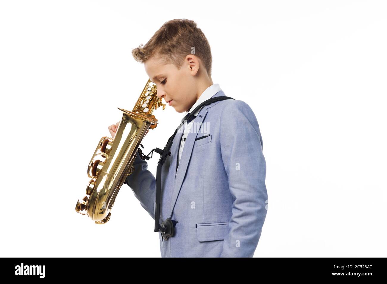 Boy musician saxophone playing a musical emotion model Stock Photo - Alamy