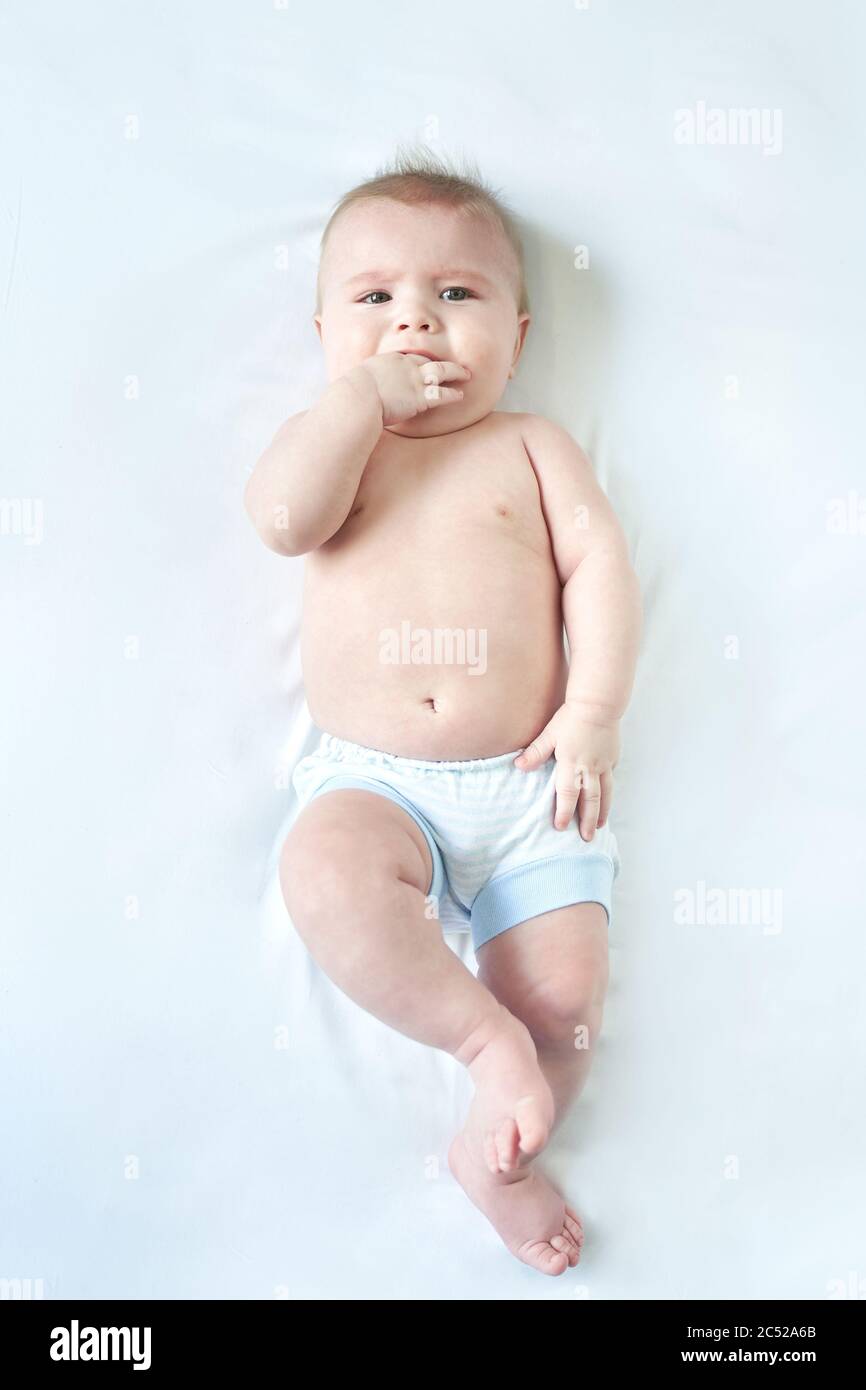 Baby hand in mouth teething hi-res stock photography and images - Alamy