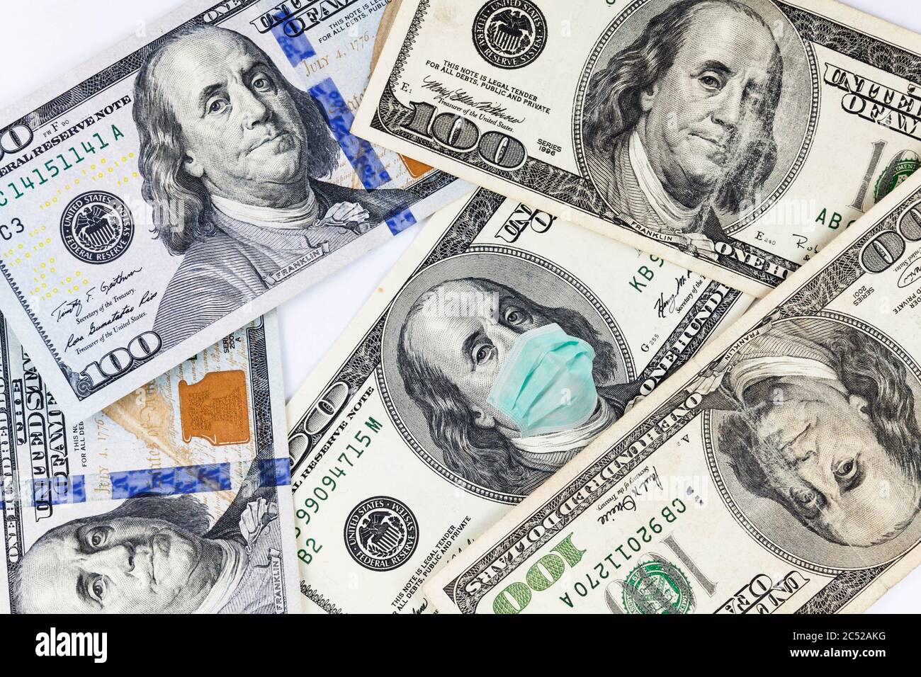 US dollar with mask indicating COVID affects on financial crisis and ...