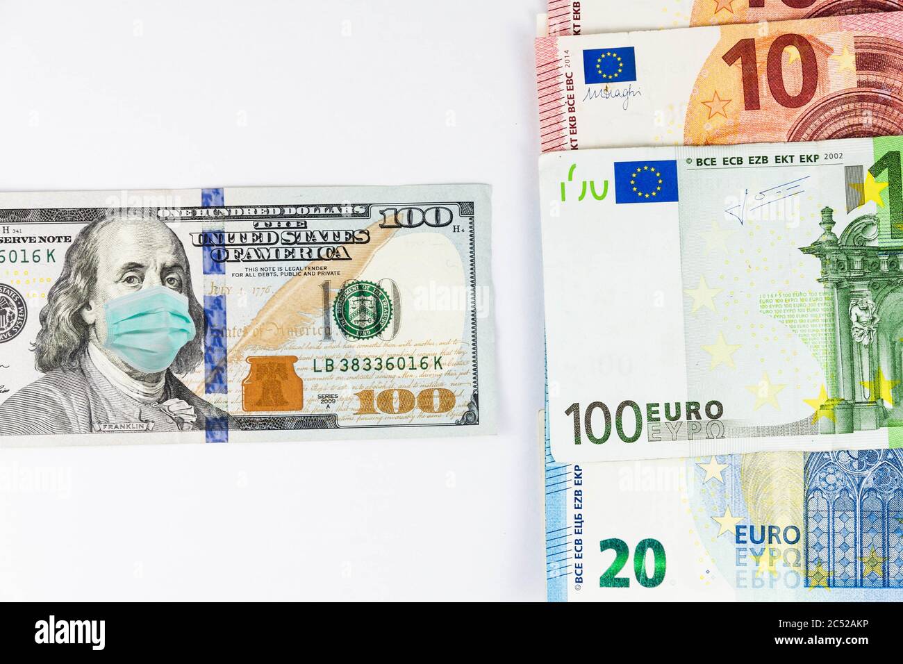 US dollar with mask indicating COVID affects on financial crisis and ...