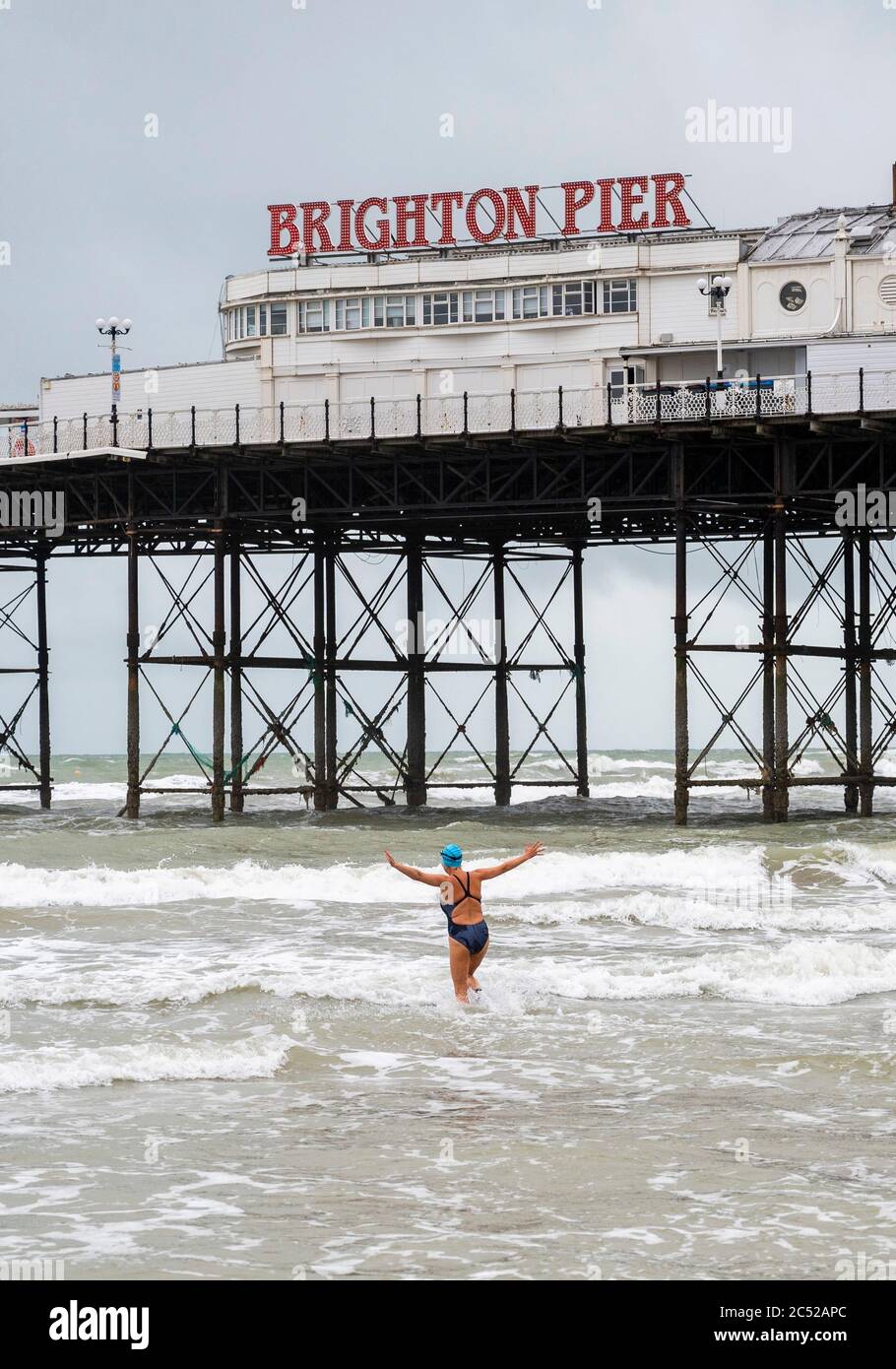 Female swimming in the rain at sea hi-res stock photography and images ...