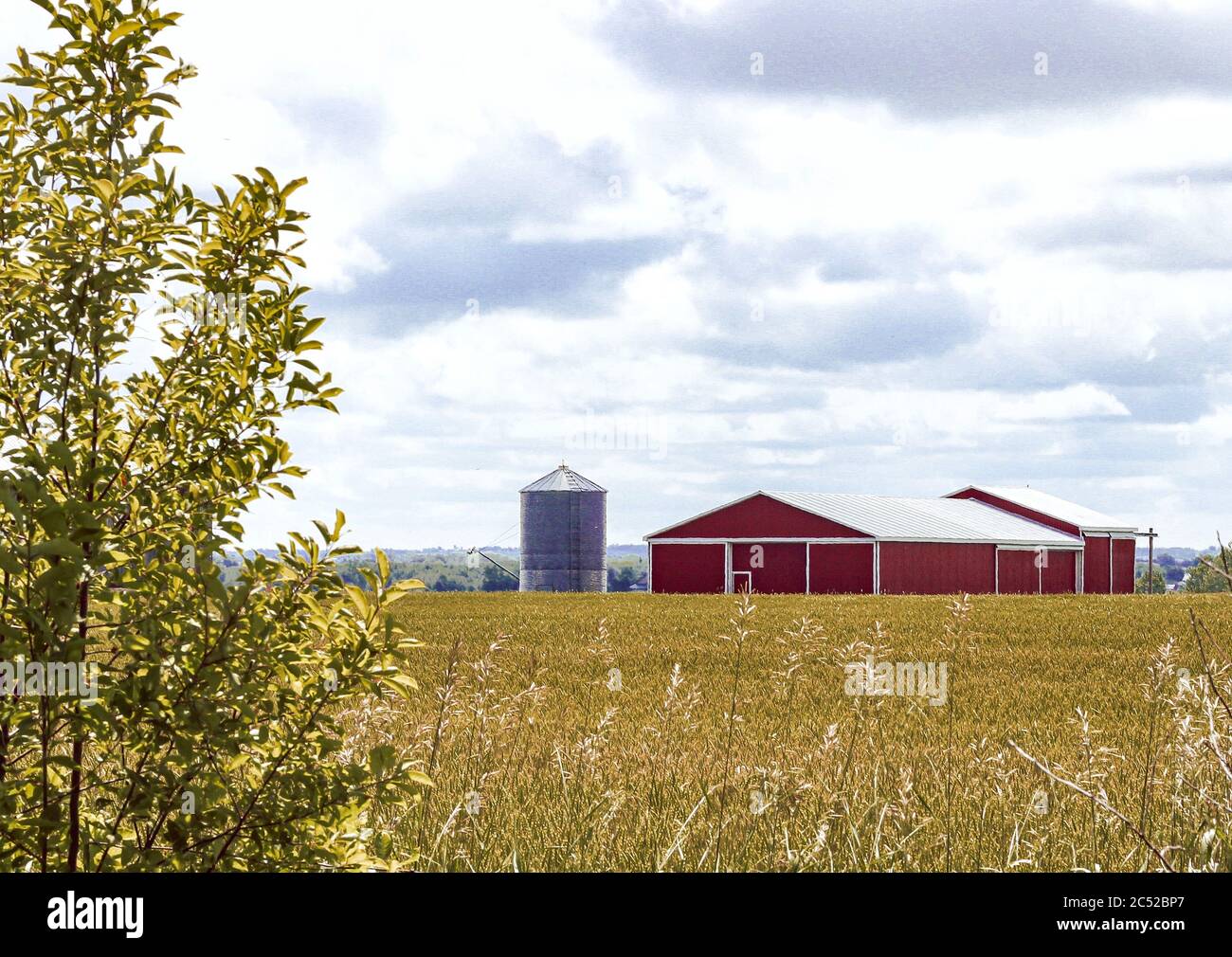 Red Barn with Silo Stock Photo - Alamy