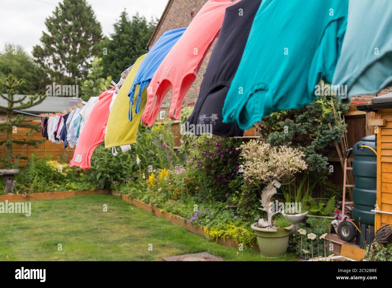 Washing hanging on long line drying in the gusty windy weather. Full ...
