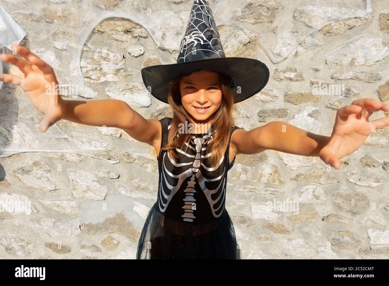 Close beautiful girl portrait in Halloween skeleton costume with spooky ...