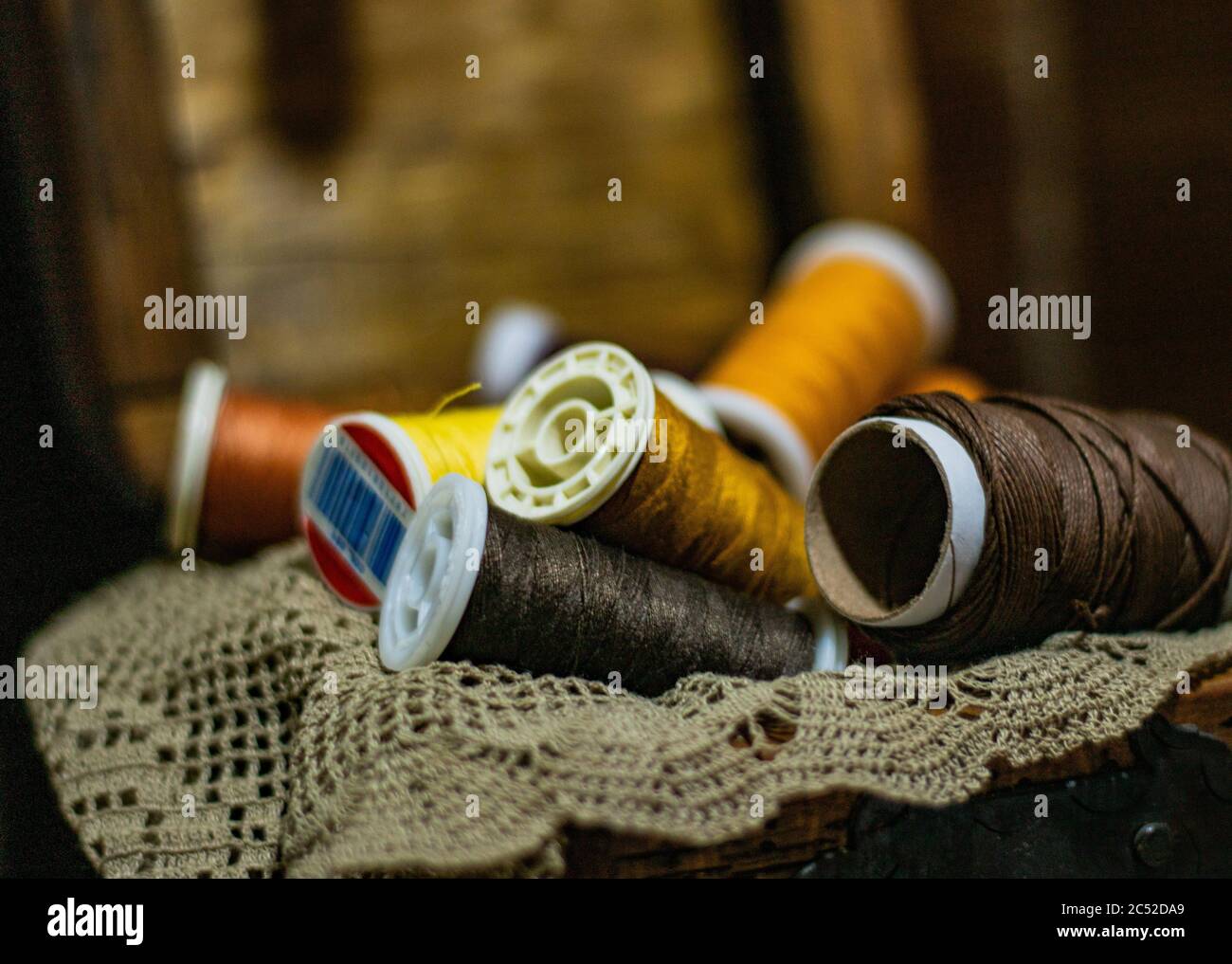 Lot of colorful yarn rolls in a woven basket in a tailor's studio Stock ...