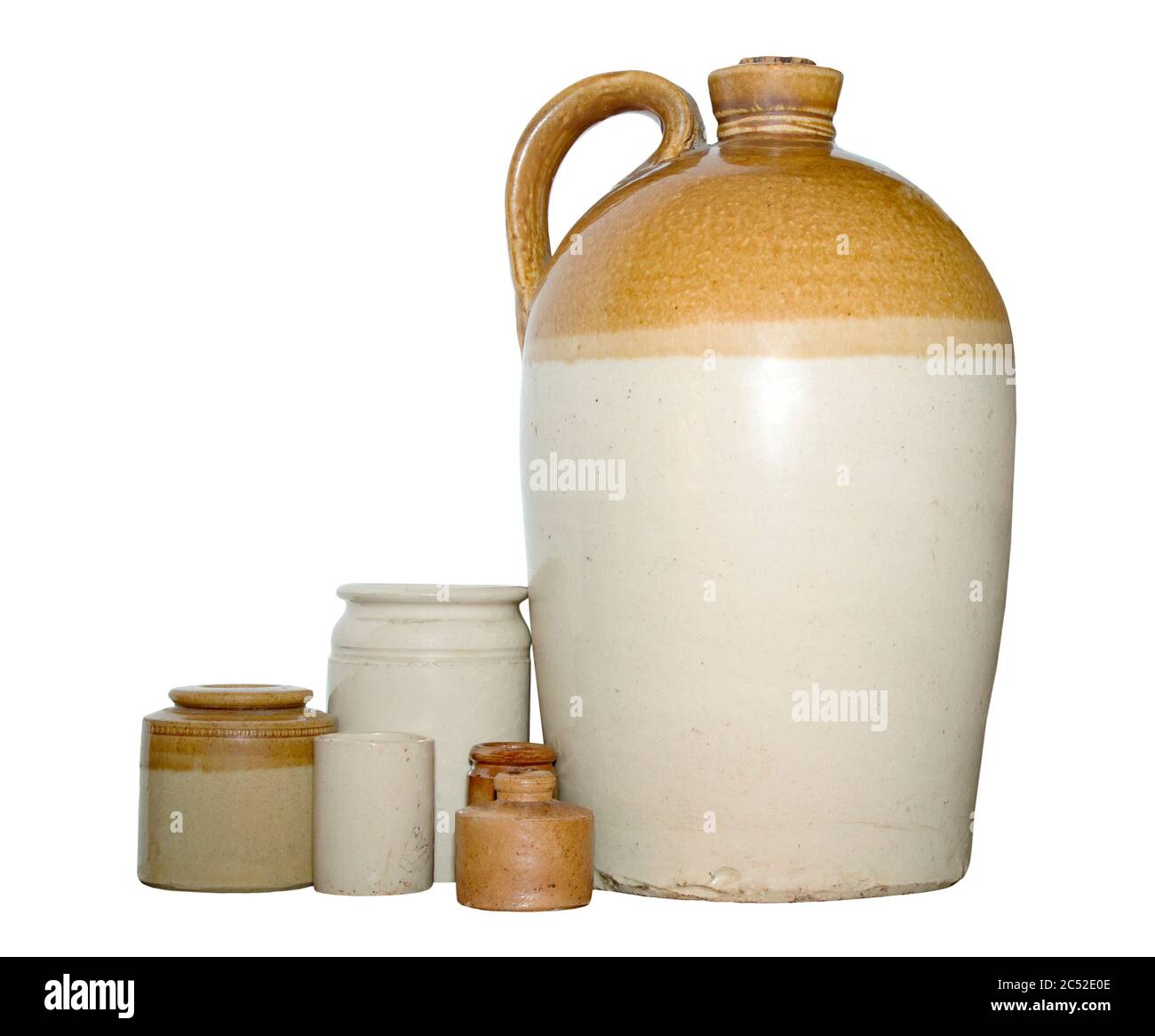 Earthenware flagon with mixed pots worn from age on an isolated white ...