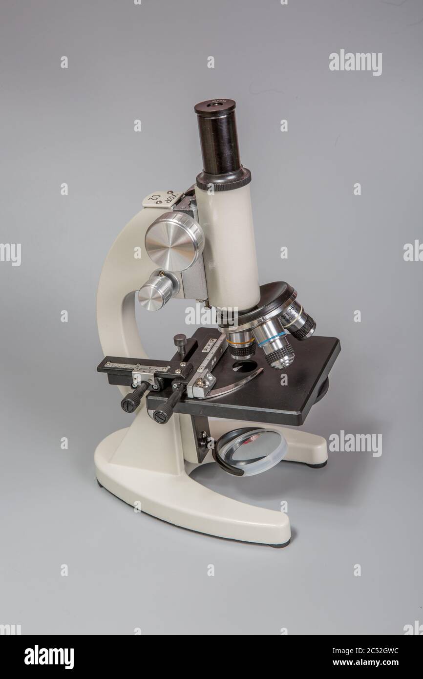 Metal microscope on white background Stock Photo - Alamy
