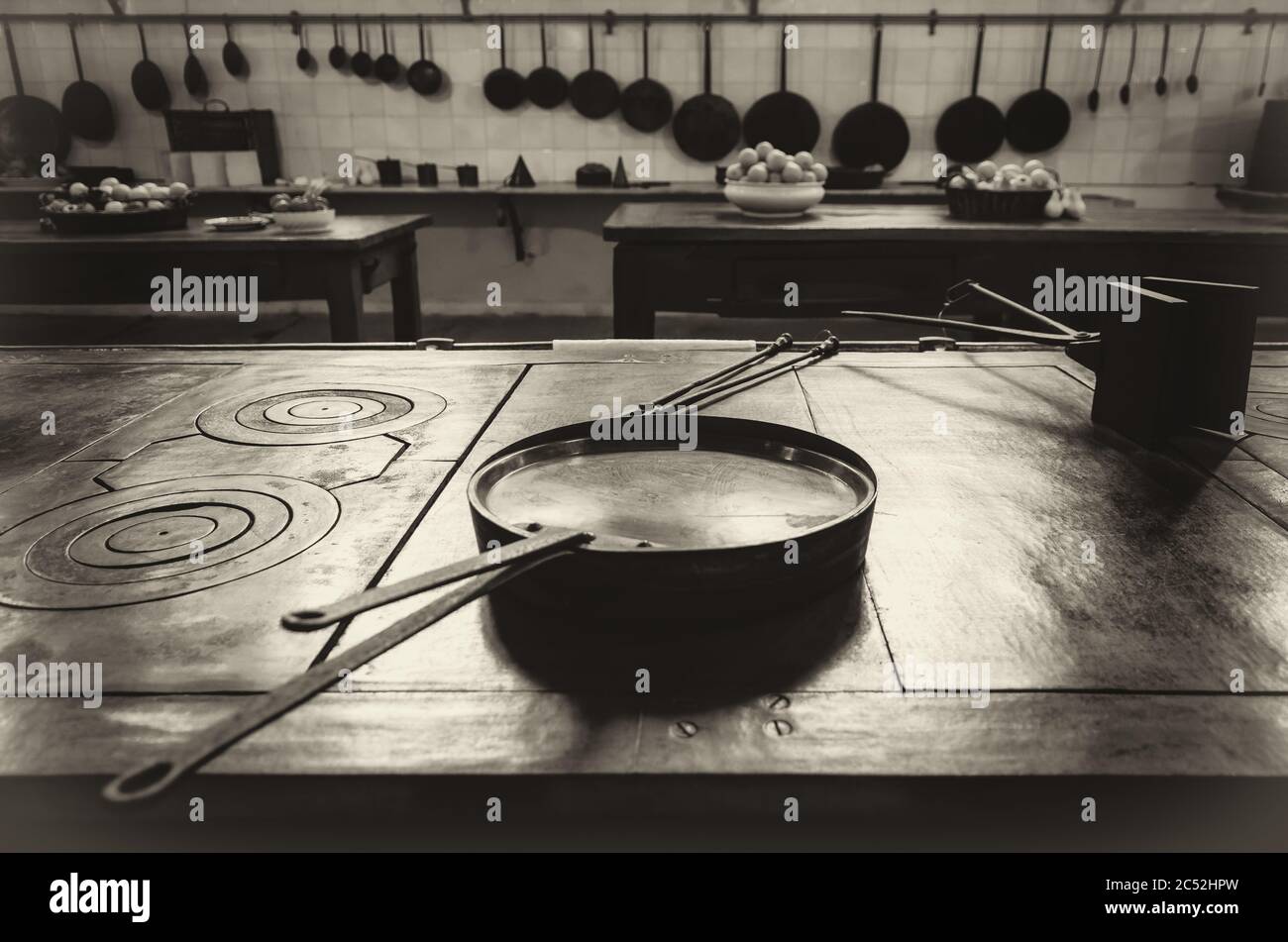 vintage looking image of an antique XIX century old kitchen with tools ...